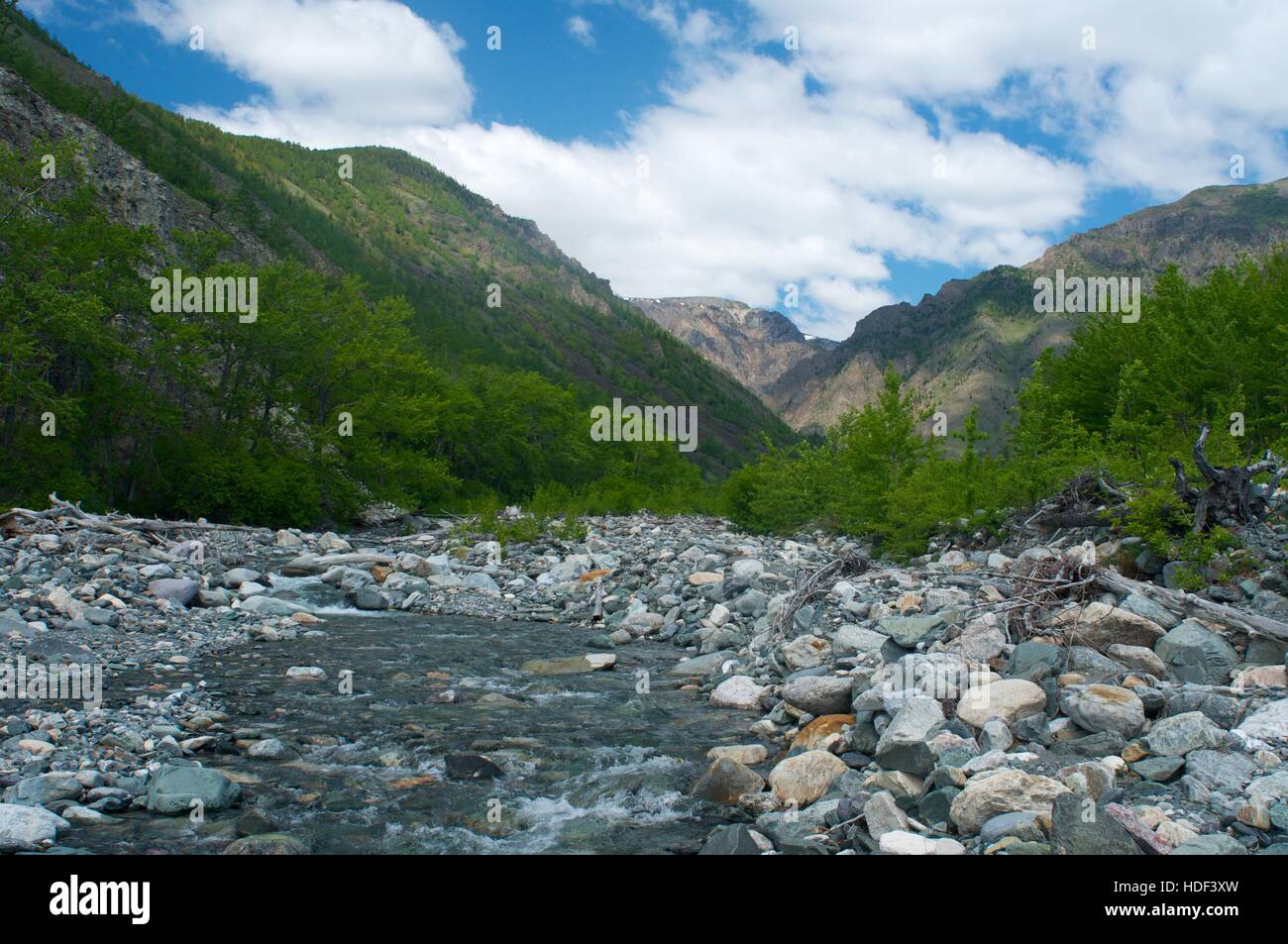 River amongst stone in valley mountains Stock Photo - Alamy