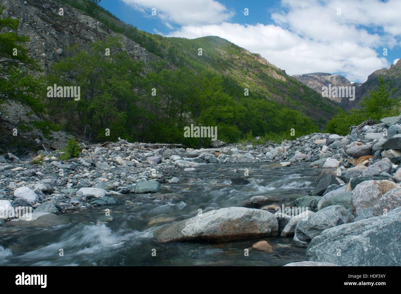 River amongst stone in valley mountains Stock Photo - Alamy