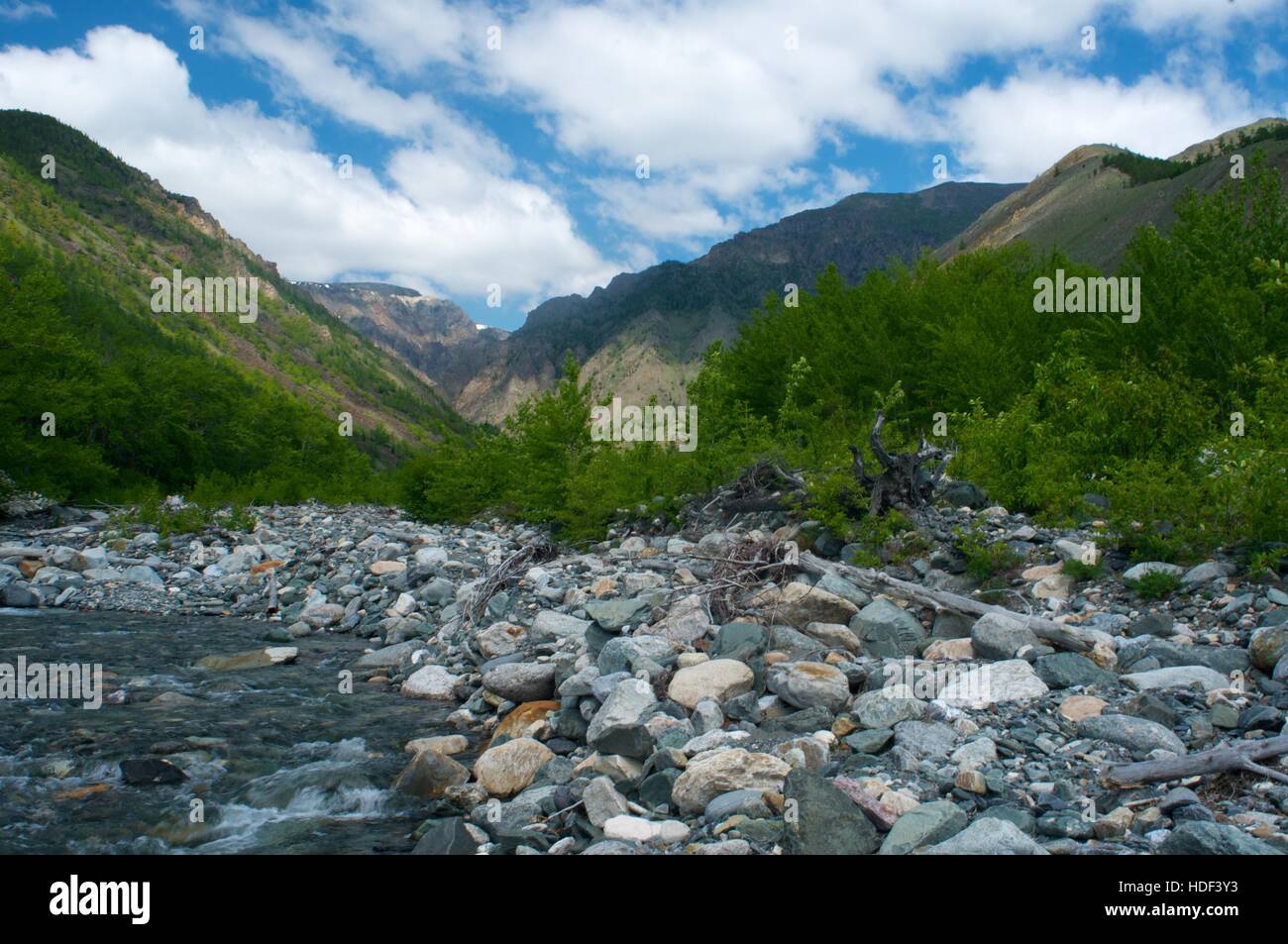 River amongst stone in valley mountains Stock Photo - Alamy