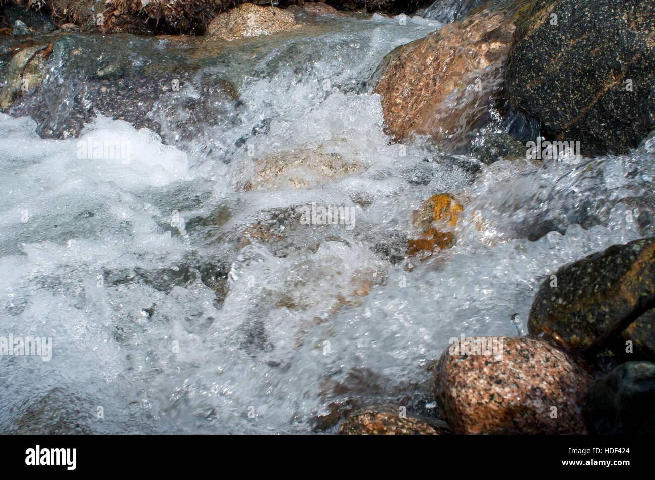 River amongst stone in valley mountains Stock Photo - Alamy