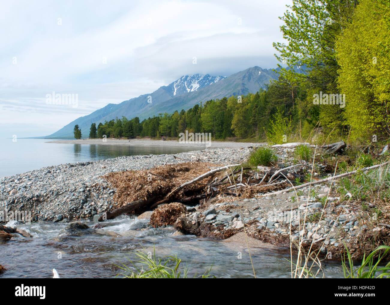 River amongst stone in valley mountains Stock Photo - Alamy