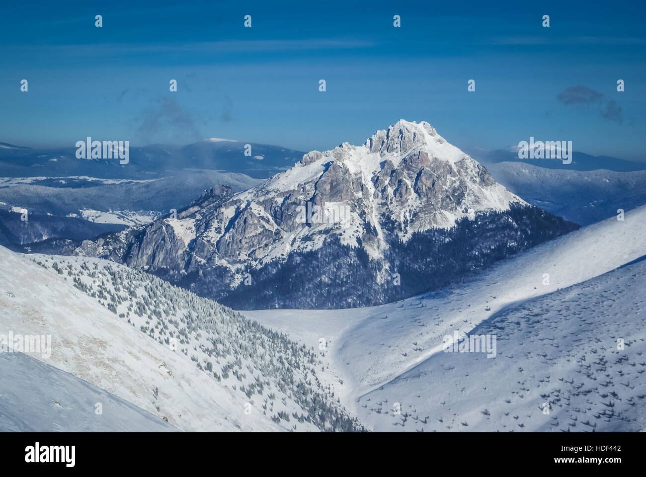 Photo of mountains covered in snow during winter in High Tatras in ...