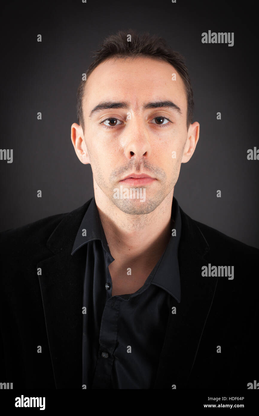 Handsome man doing different expressions in different sets of clothes ...