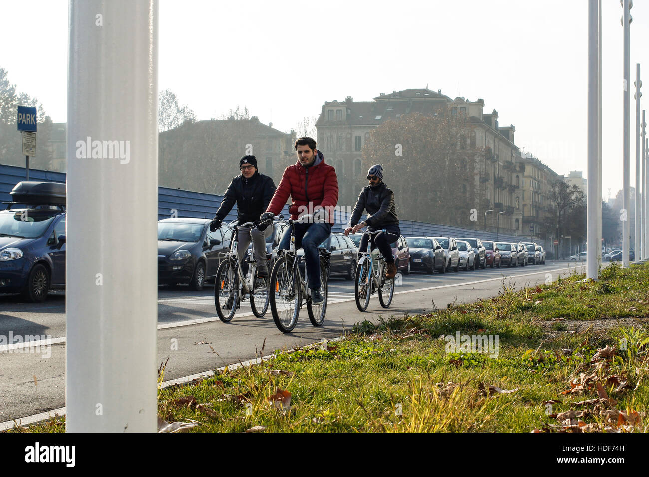 Group of people riding their bike in a cycle lane in Italy Stock Photo ...