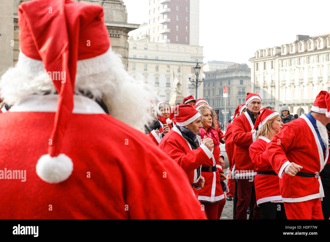 People dancing in a squadre with Santa Claus costumes in Italy Stock ...