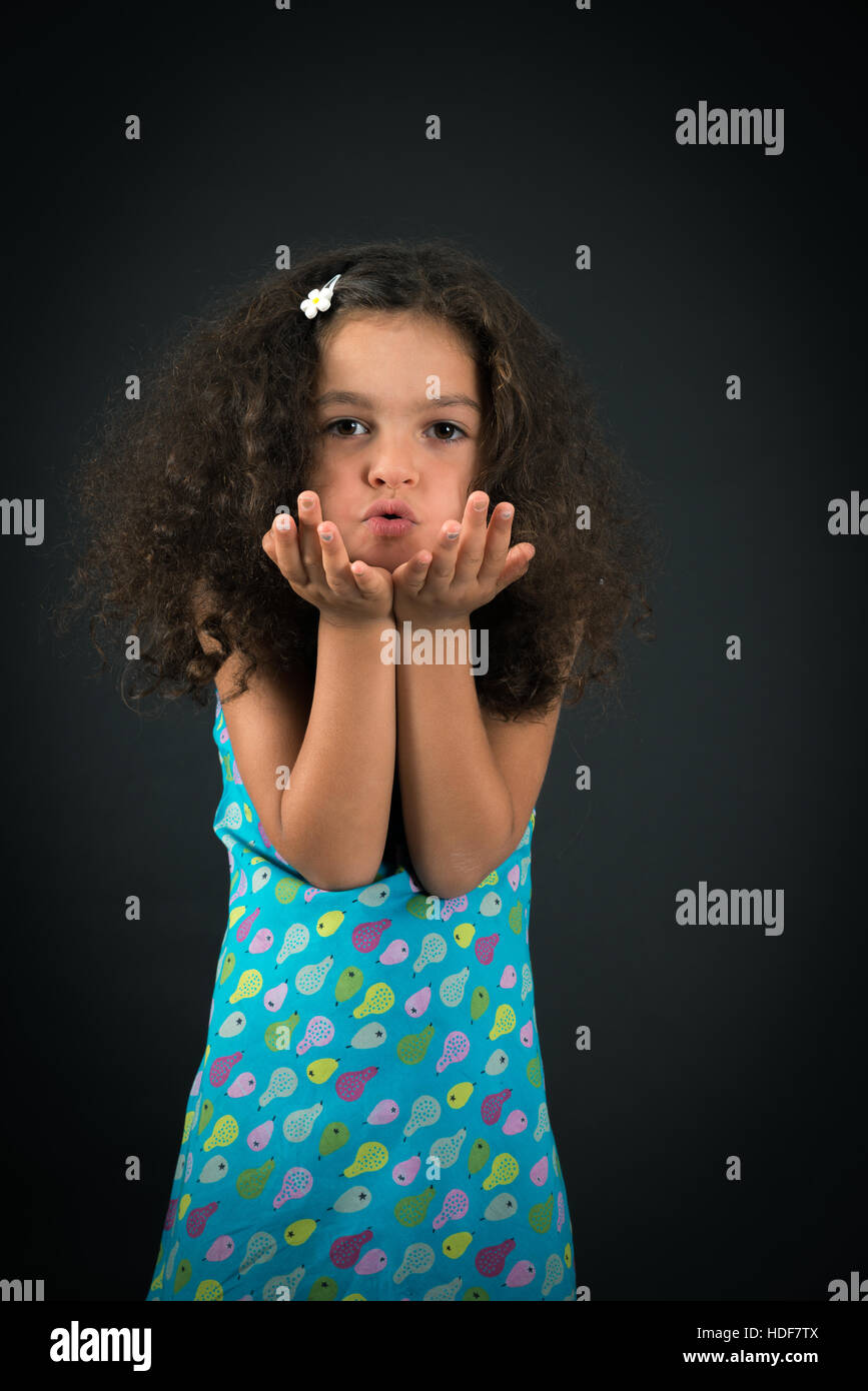 Beautiful girl doing different expressions in different sets of clothes ...