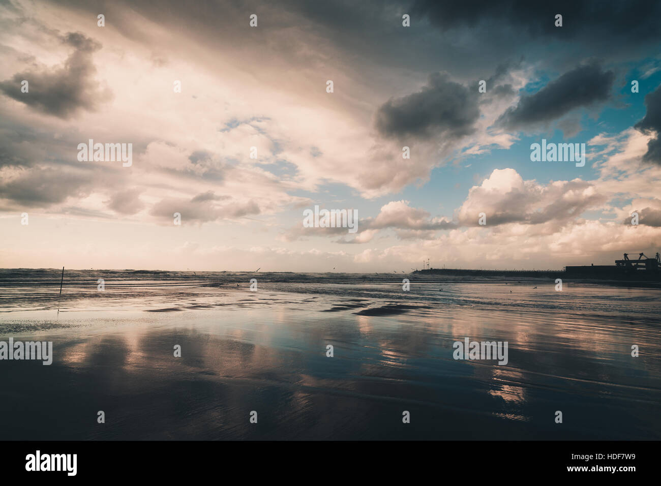 Sea waves with a reflection on the shore Stock Photo - Alamy