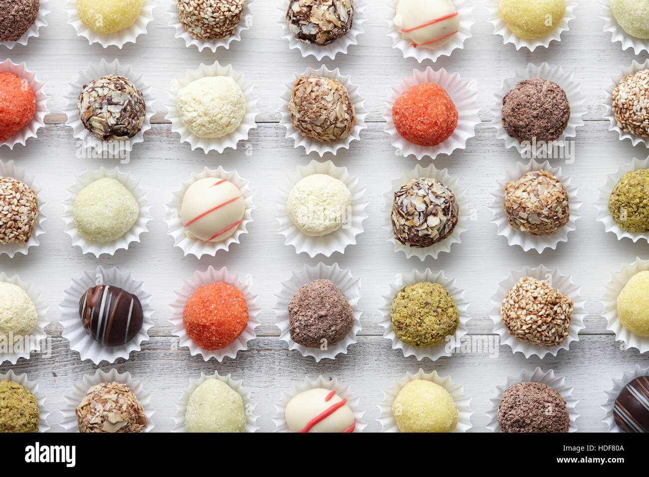 Truffle chocolates in rows Stock Photo - Alamy