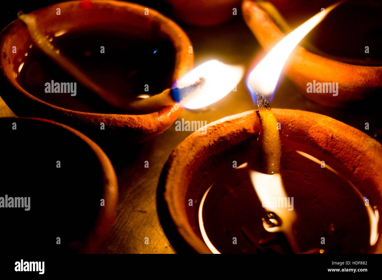 Earthen ware pots with cotton and oil to light Stock Photo - Alamy