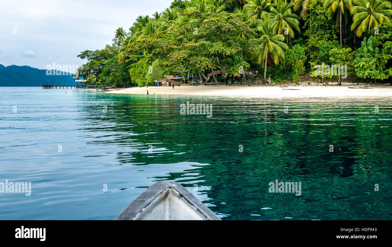 Boat approaching local Village on Friwen Island, West Papuan, Raja ...