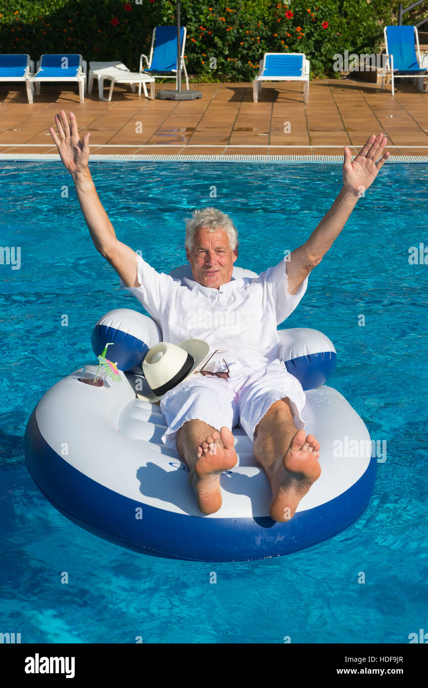 wealthy man cheering and relaxing in own swimming pool Stock Photo - Alamy