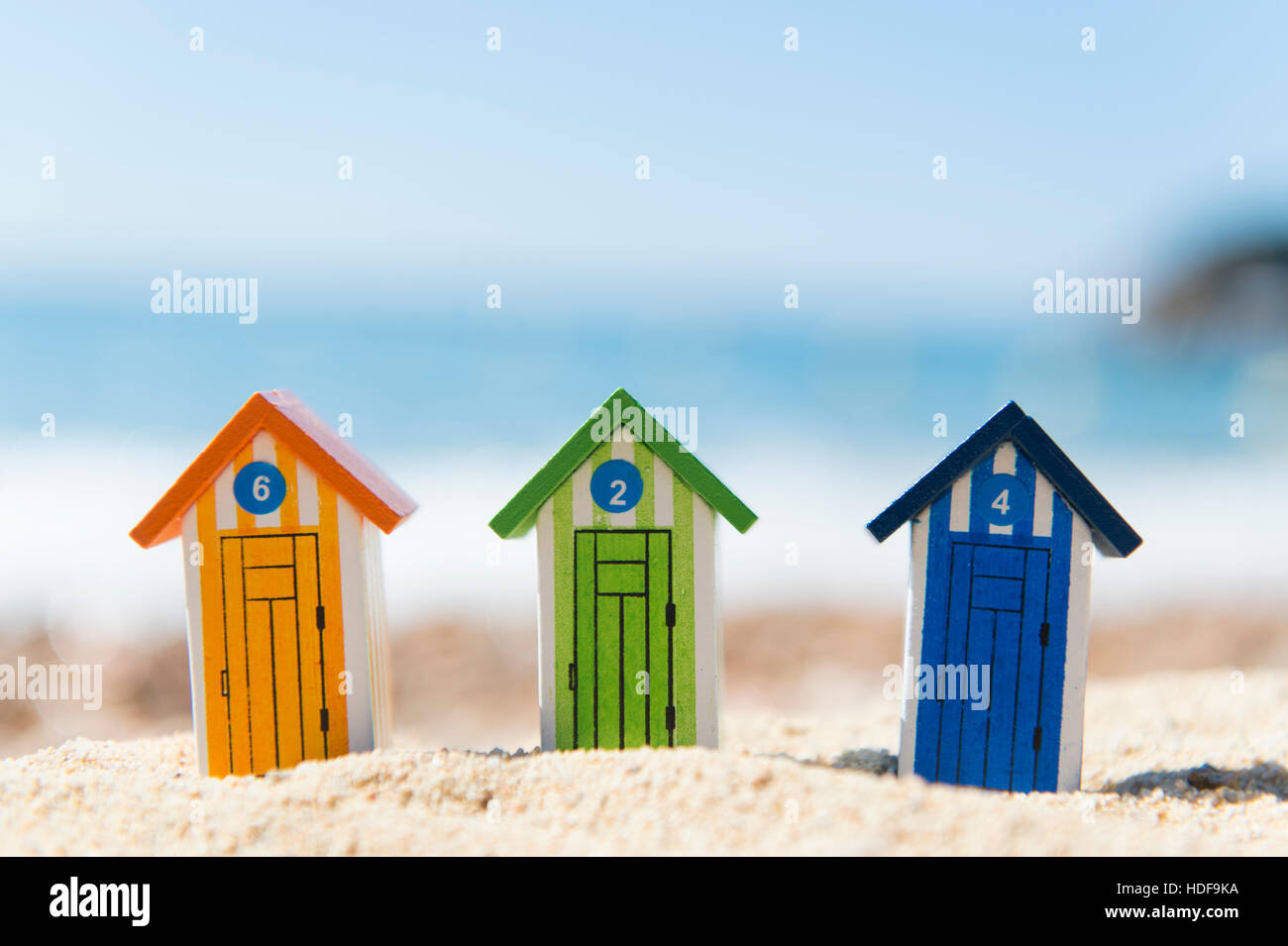 Colorful striped wooden beach cabins at the coast Stock Photo - Alamy