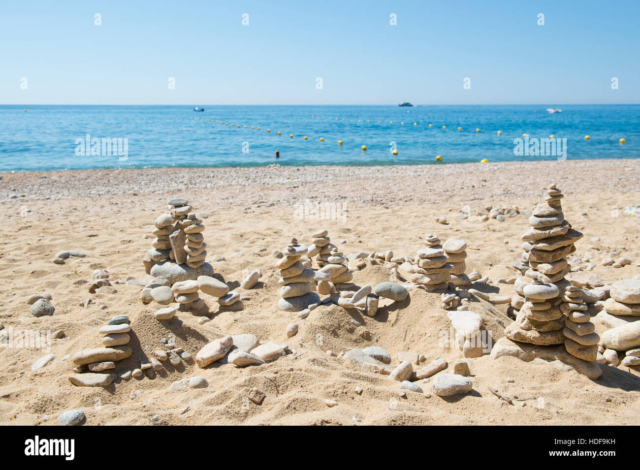 Stacked stones at the beach Stock Photo - Alamy