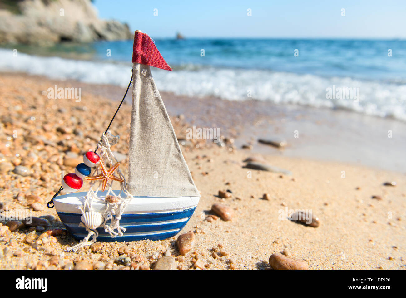 Miniature fishing boat at beach Stock Photo - Alamy