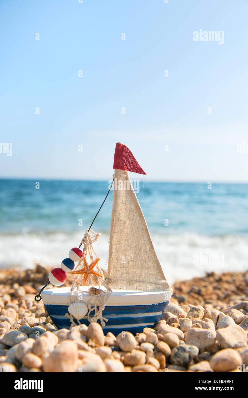 Miniature fishing boat at beach Stock Photo - Alamy