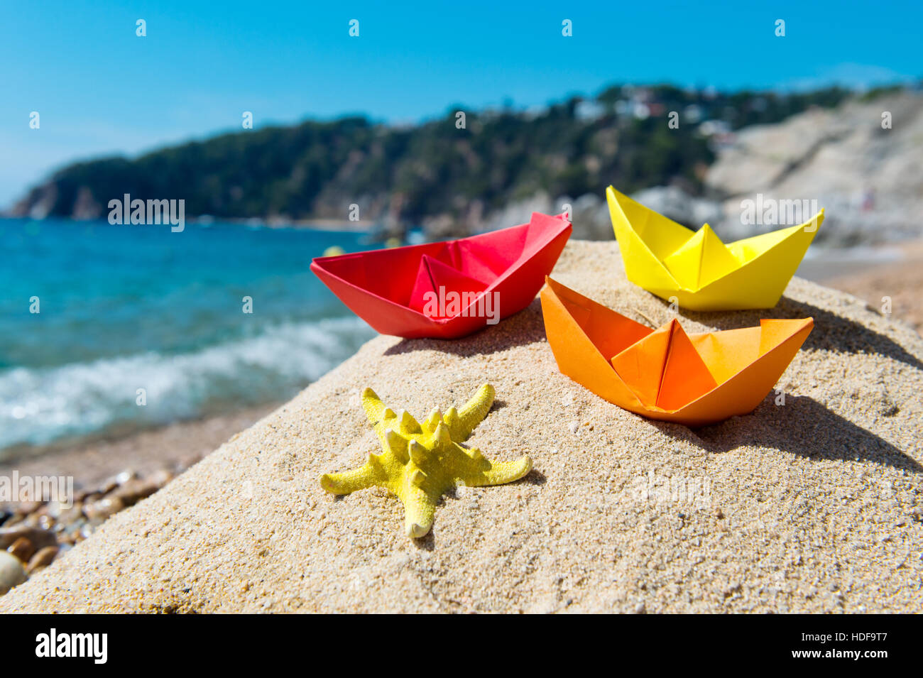 Colorful paper boats at the beach Stock Photo - Alamy