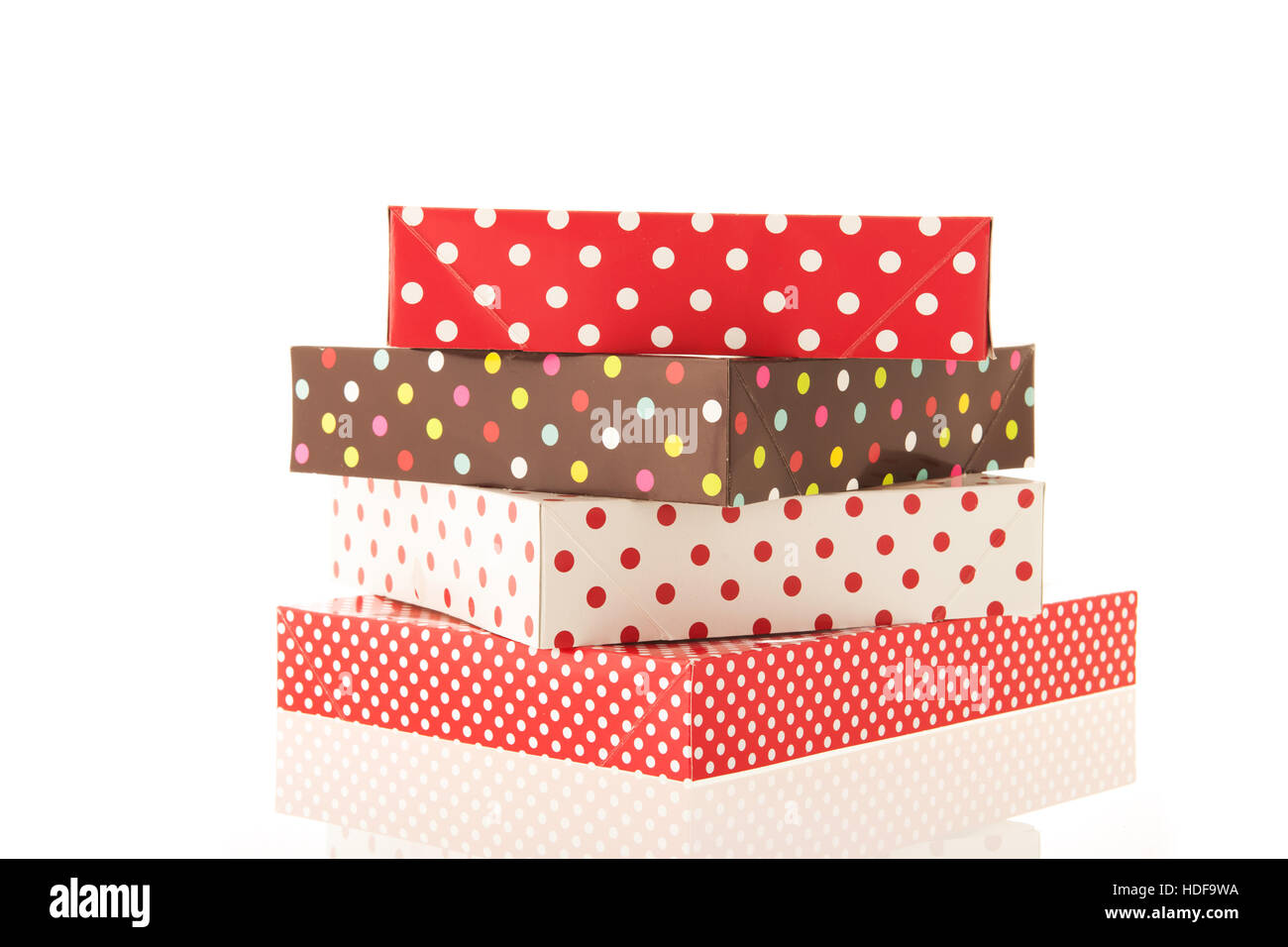 Wrapped gifts in dotted boxes isolated over white background Stock ...