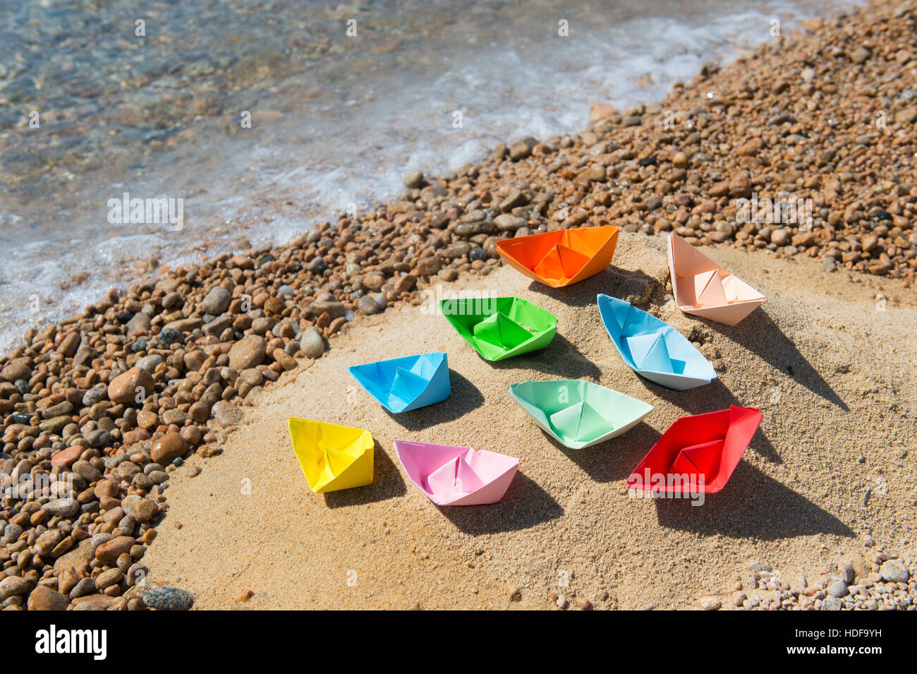 Manu paper boats in the sand at the beach Stock Photo - Alamy