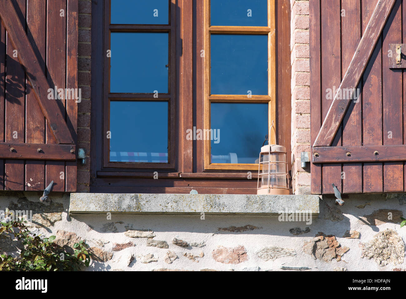 French windows with shutters and light equipment Stock Photo - Alamy