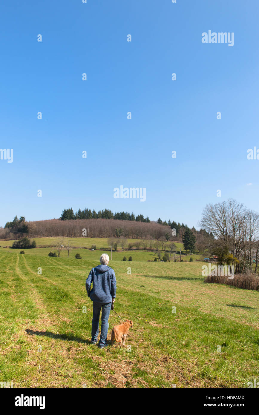 Man with dog in landscape French Limousin Stock Photo - Alamy