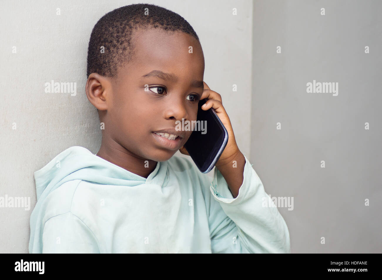 child on the phone, listening intently his interlocutor Stock Photo - Alamy