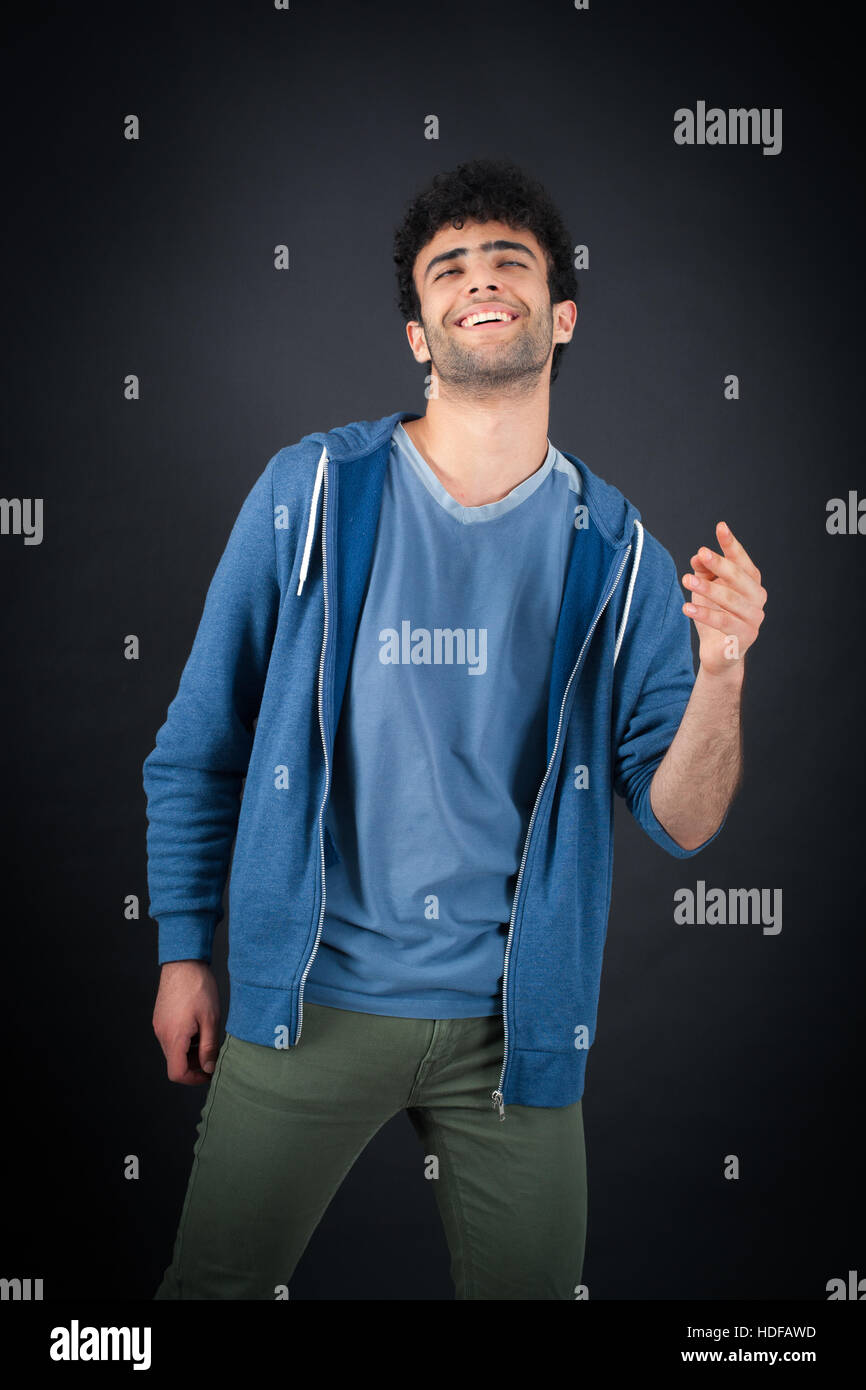 Handsome man doing different expressions in different sets of clothes ...