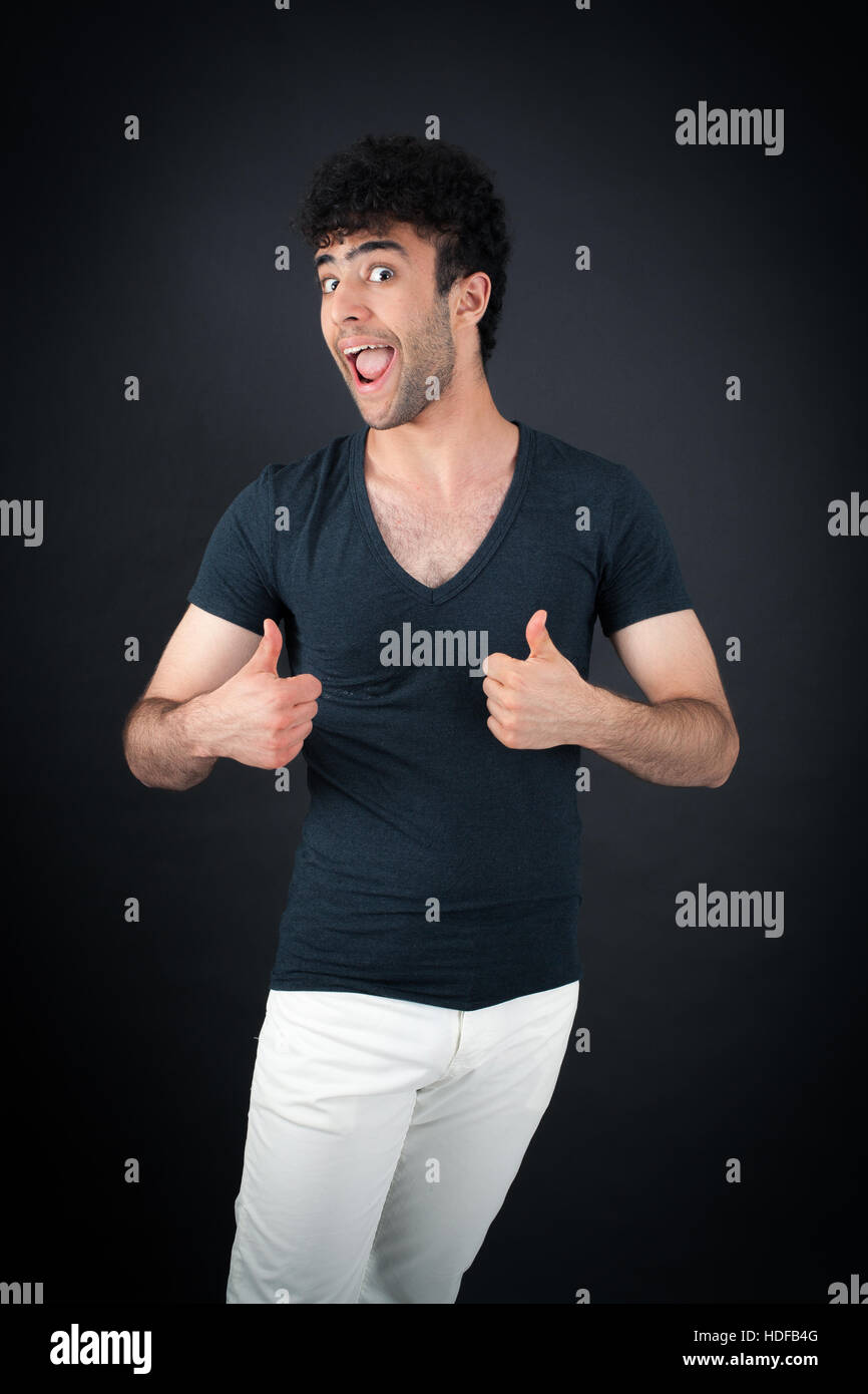 Handsome man doing different expressions in different sets of clothes ...