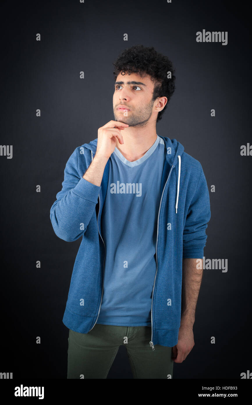 Handsome man doing different expressions in different sets of clothes ...