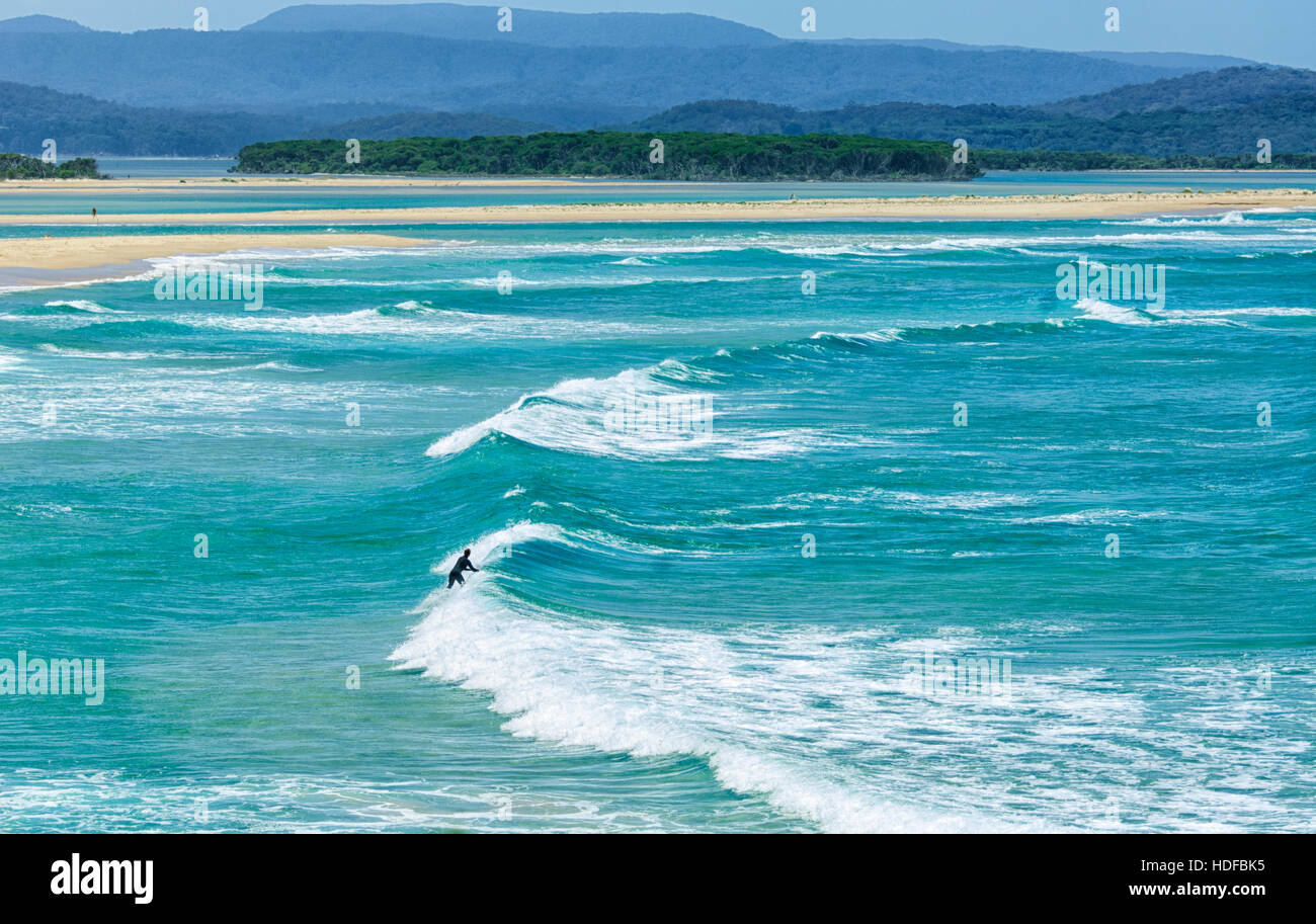 Lone surfer in heavy seas at Bastion Point, Mallacoota, Victoria, VIC ...