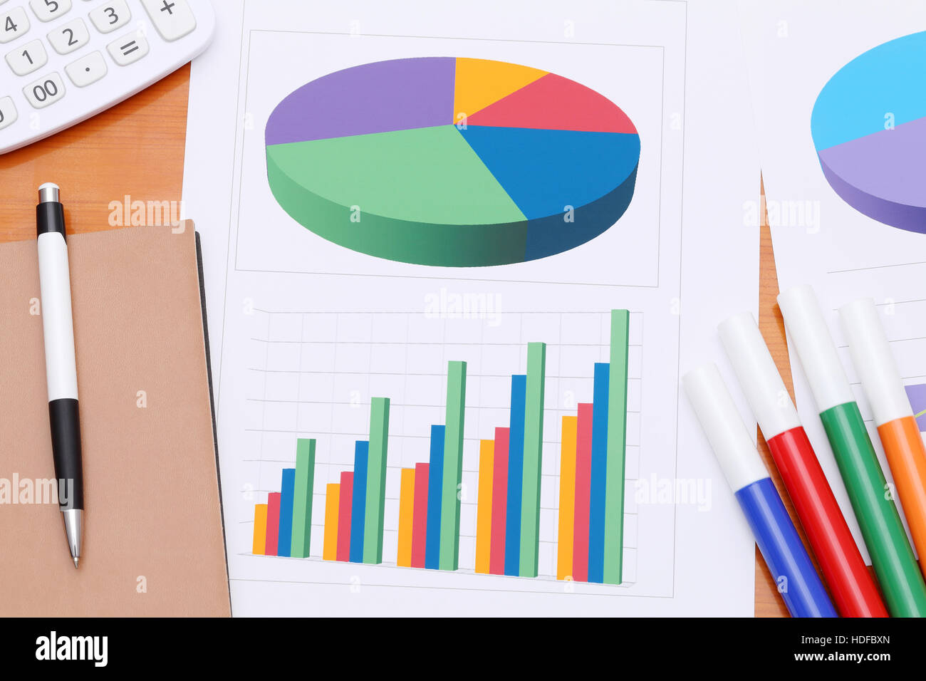 Color chart printed on paper sheet with pen and notebook, calculator on ...