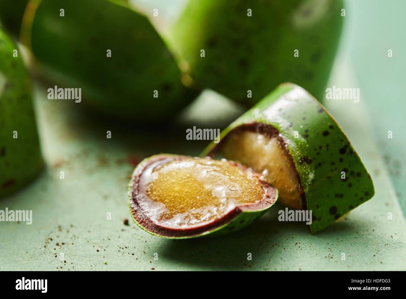 broken candy with jelly on a green background Stock Photo - Alamy