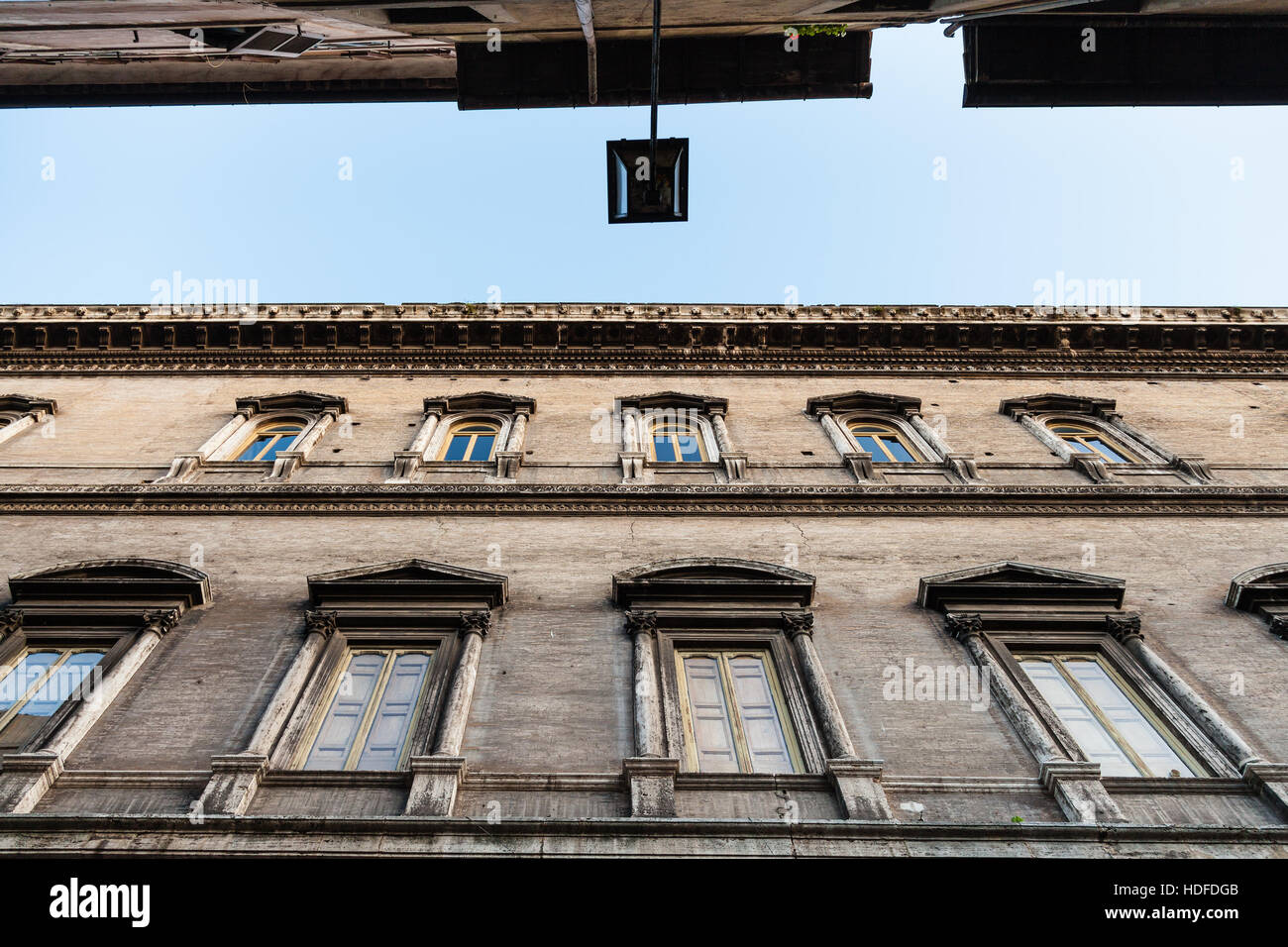 travel to Italy - bottom view of dark facades of old houses on narrow ...
