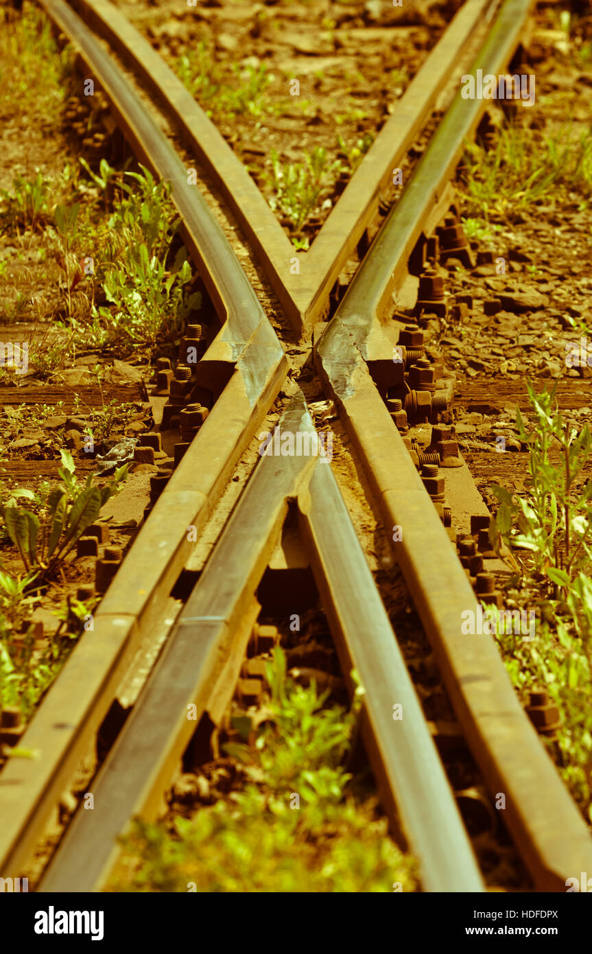 Old railway tracks forming the letter x Stock Photo - Alamy