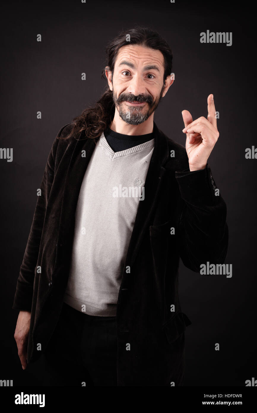 Handsome man doing different expressions in different sets of clothes ...