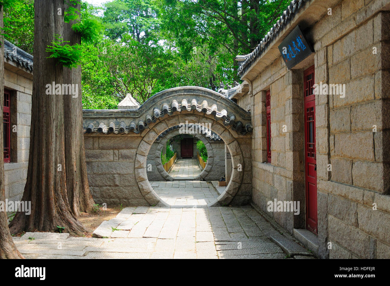 Curved archways, cypress trees and chinese architecture within the ...