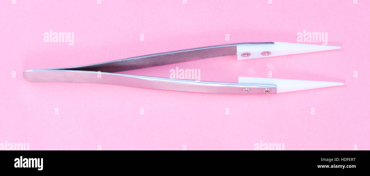 Pink tweezers hi-res stock photography and images - Alamy
