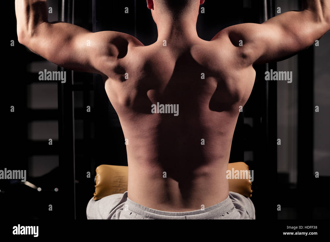 Handsome Man Athlete Doing Pull Ups - Chin-Ups In The Gym Stock Photo ...