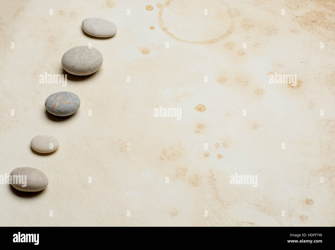 old paper and stone on it with copy space Stock Photo - Alamy