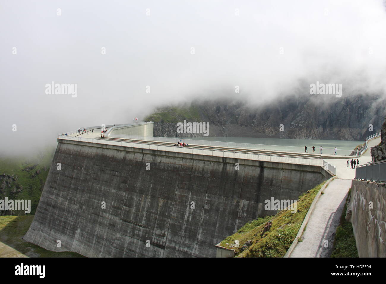 Barrage de Dixence (Dixence Dam) emerging from the clouds Stock Photo ...