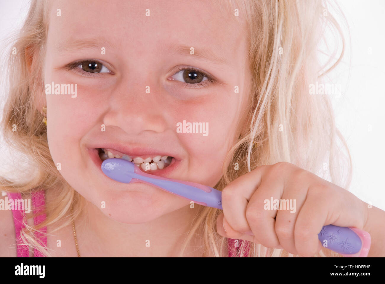 Girl, 6 years old, brushing her teeth Stock Photo - Alamy
