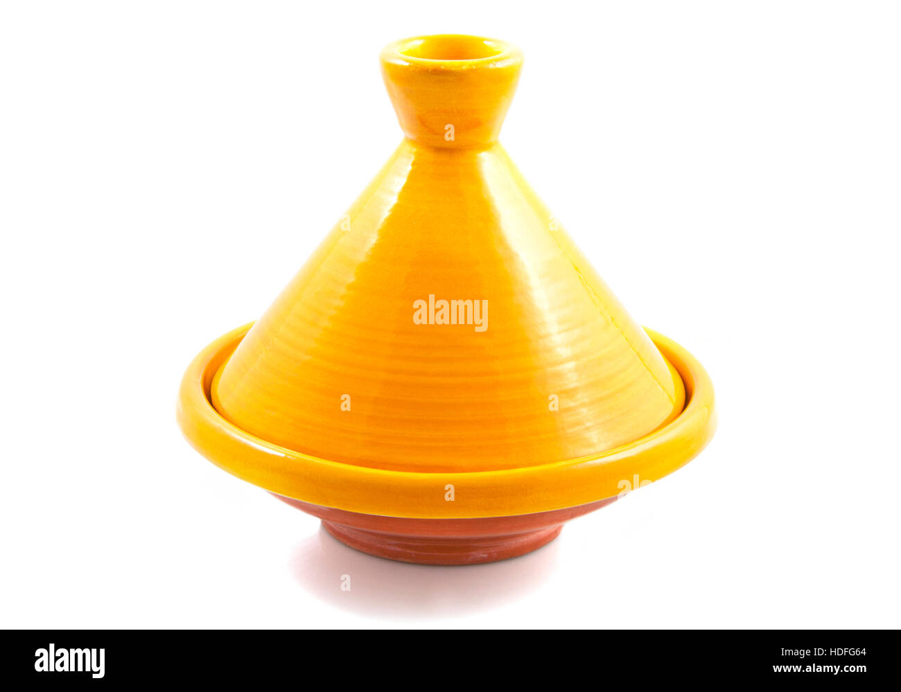 Yellow tajine close-up isolated on a white background Stock Photo - Alamy