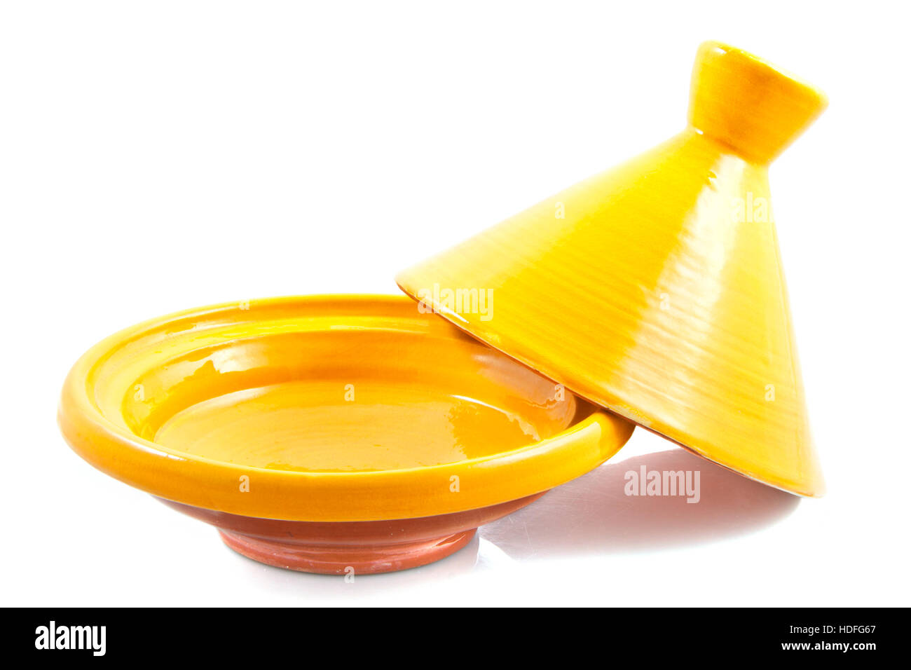 Yellow tajine close-up isolated on a white background Stock Photo - Alamy