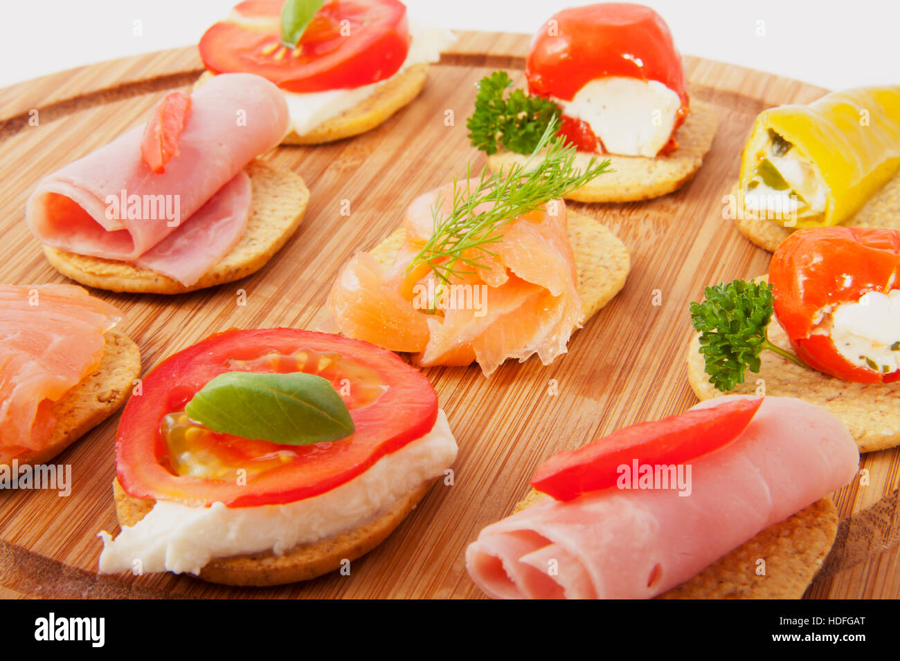 Fresh delicious healthy tapas on a wooden plate for background use ...