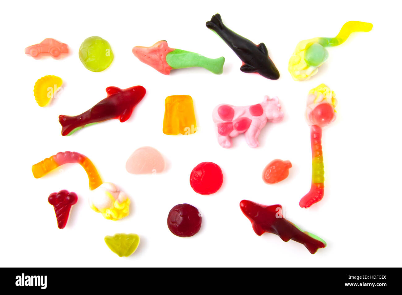 Colorful candy in a row isolated on a white background Stock Photo - Alamy