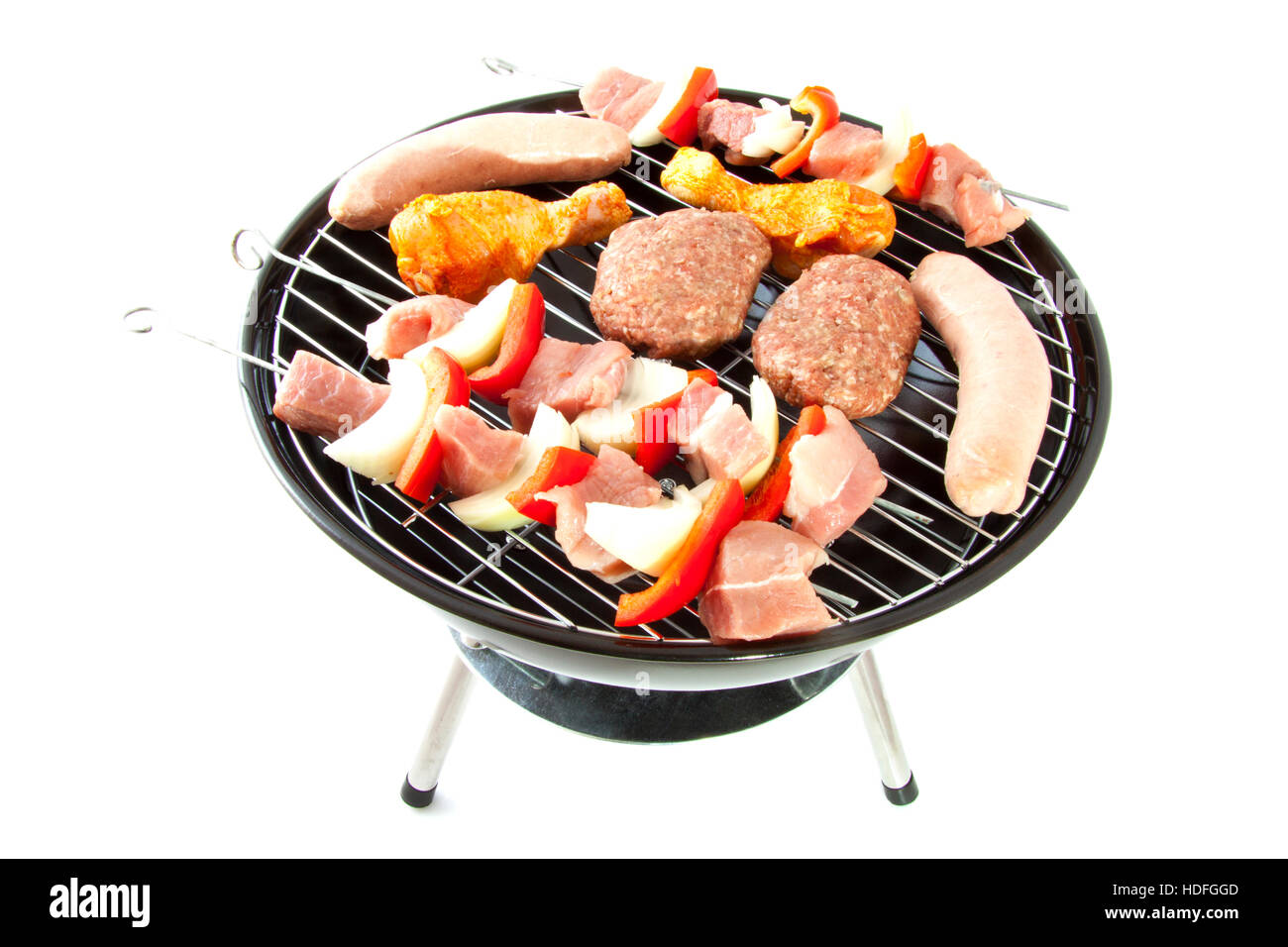 Different kind of meat on a bbq isolated over white Stock Photo - Alamy