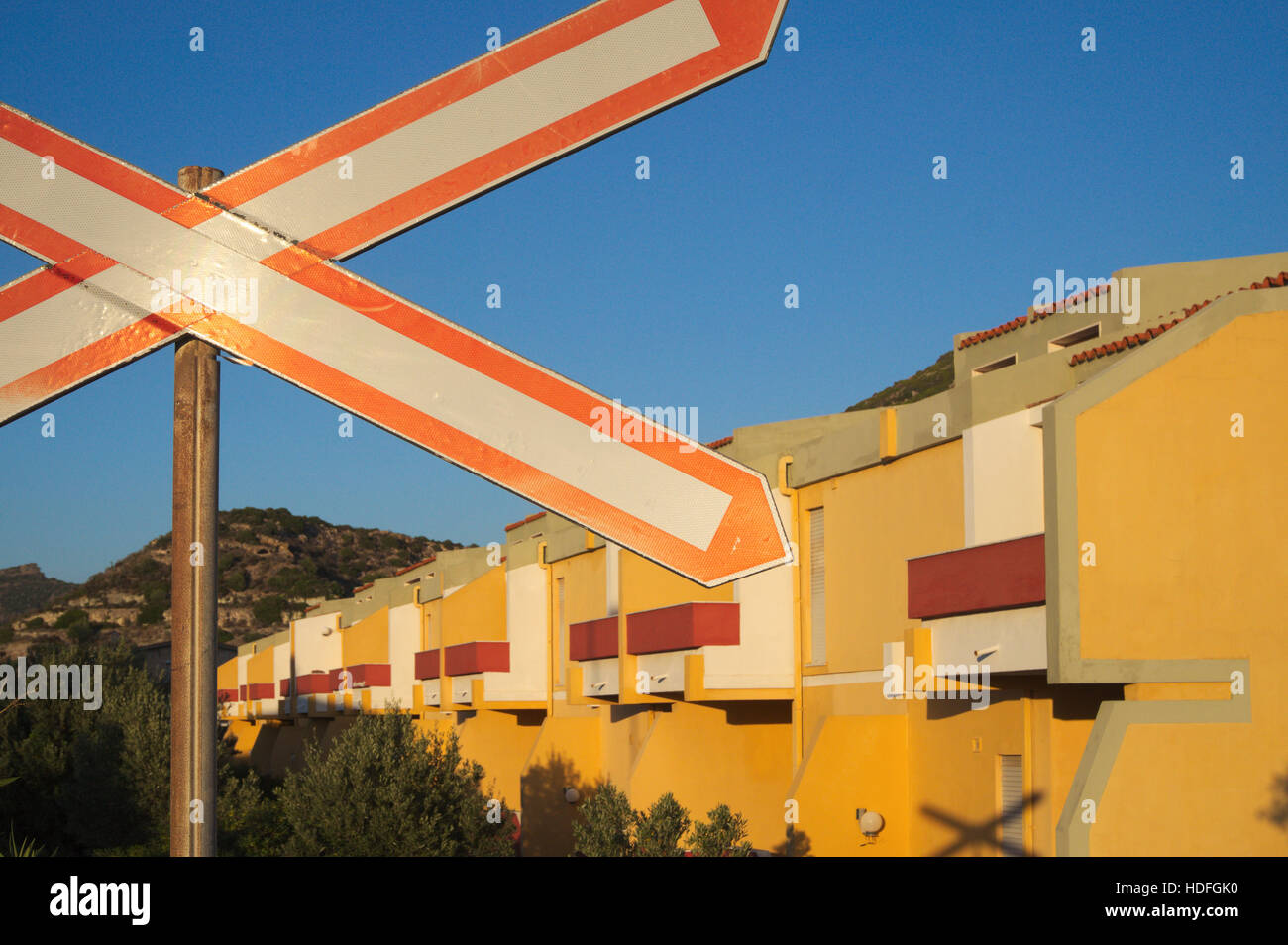 railroad crossing sign near residential buildings in Italy Stock Photo ...