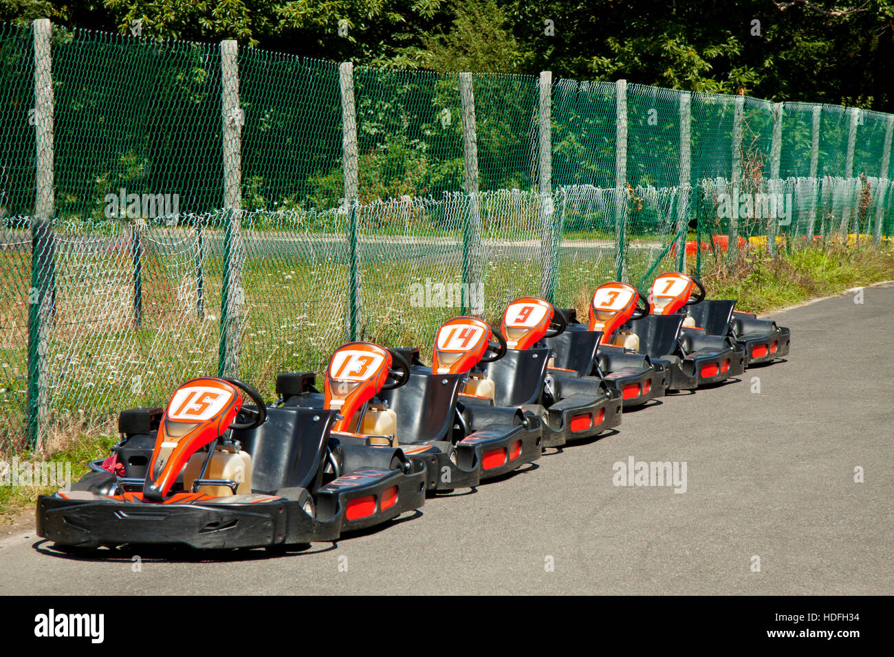 Carting-cars in a row in front of a fence for background use Stock ...