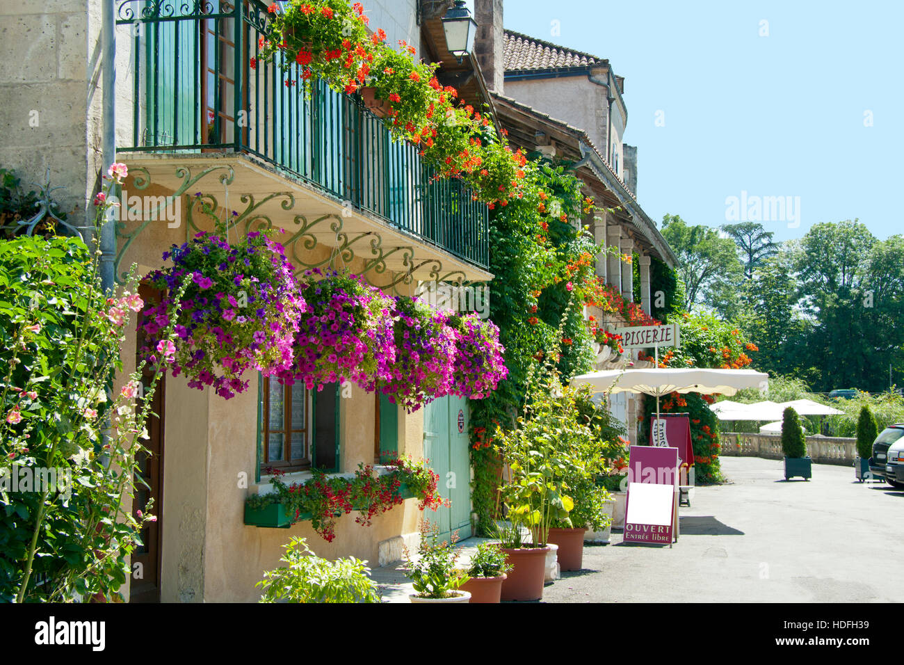 Beautiful village in france with lots of flowers in the summer Stock ...