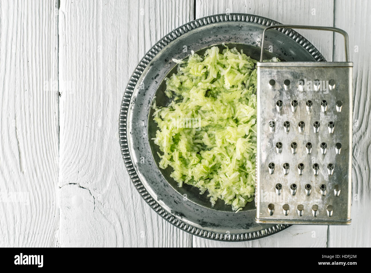 Grated cucumber in the metal plate top view Stock Photo - Alamy