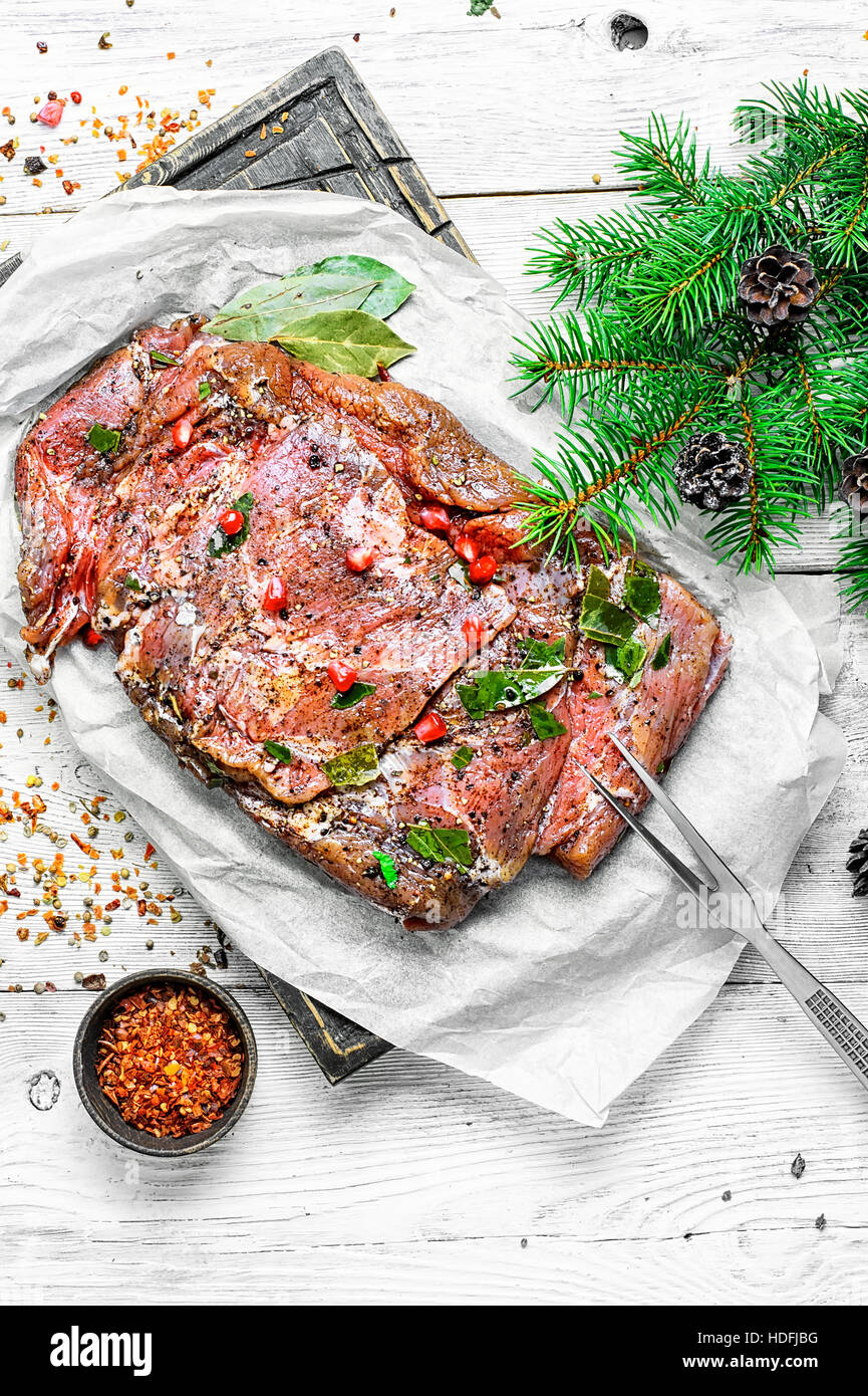 Meat knuckle ,soaked in pomegranate sauce and spices Stock Photo - Alamy